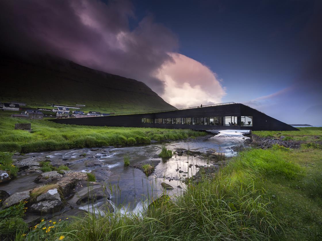 Henning Larsen completes building that doubles as bridge | News ...